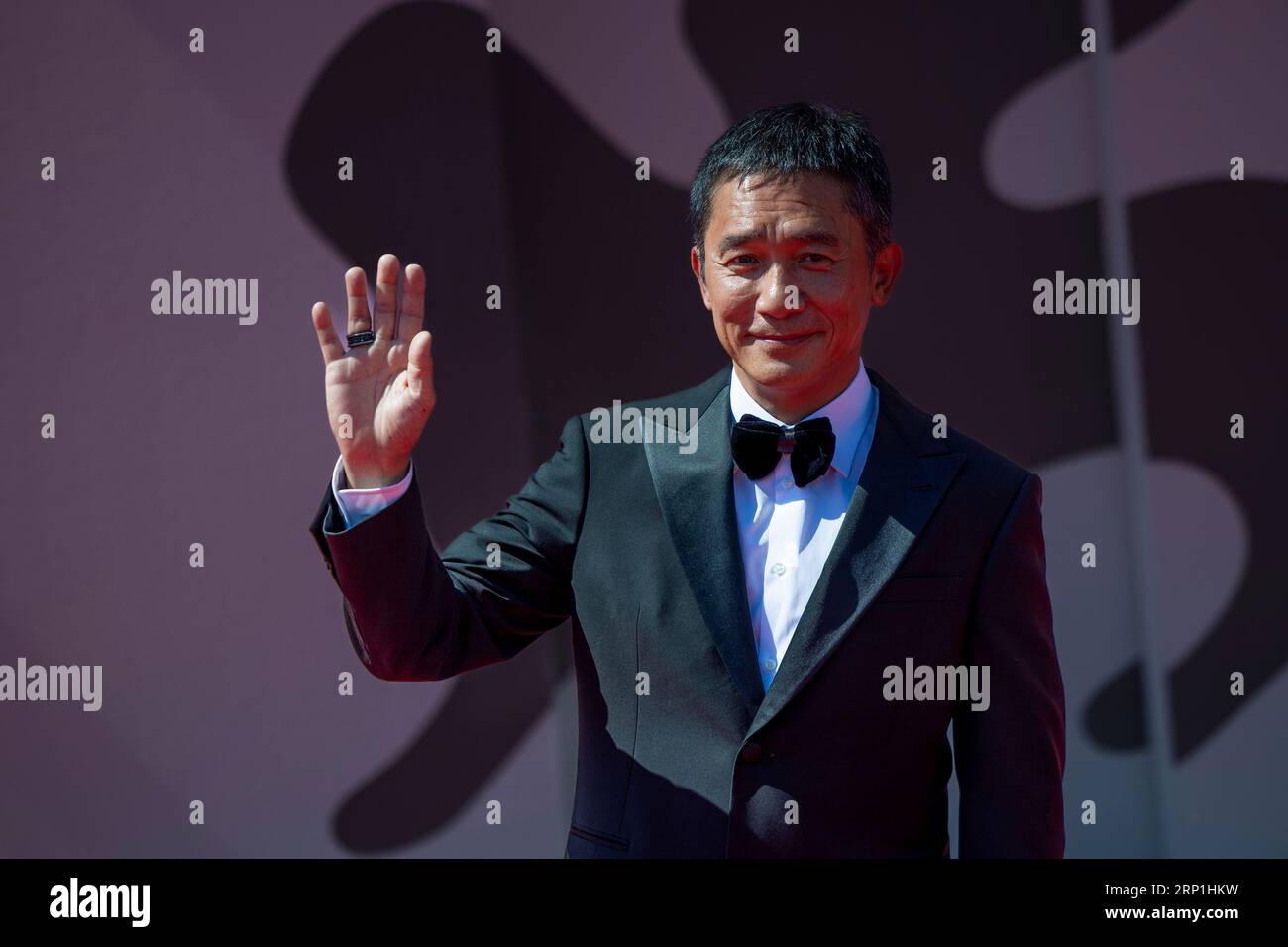 Tony Leung poses for photographers upon arrival for the Golden Lion for ...