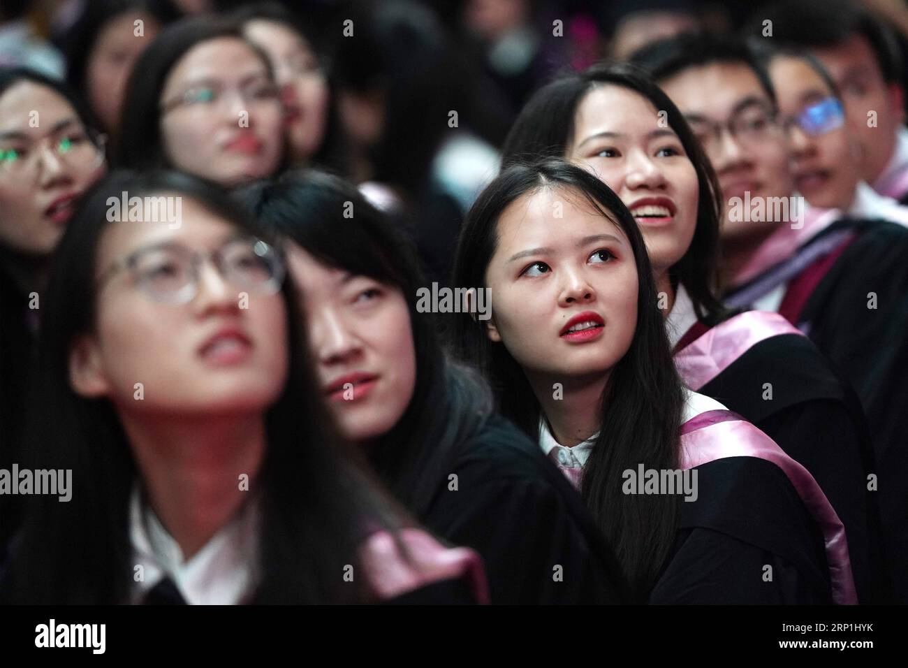 University graduates attend graduation ceremony hi-res stock ...