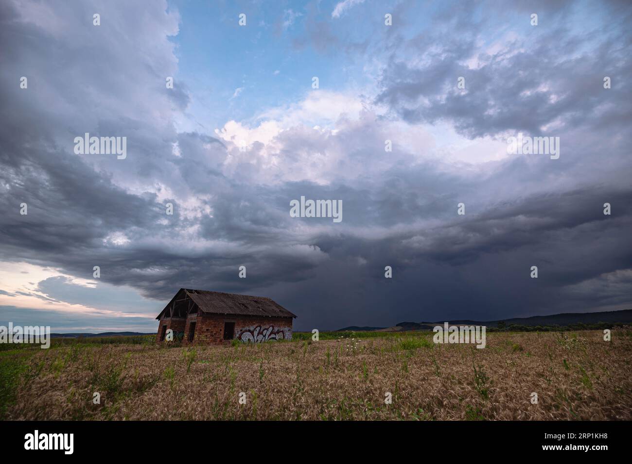 Dramatic looking Cumulonimbus storm cloud over the countryside of ...