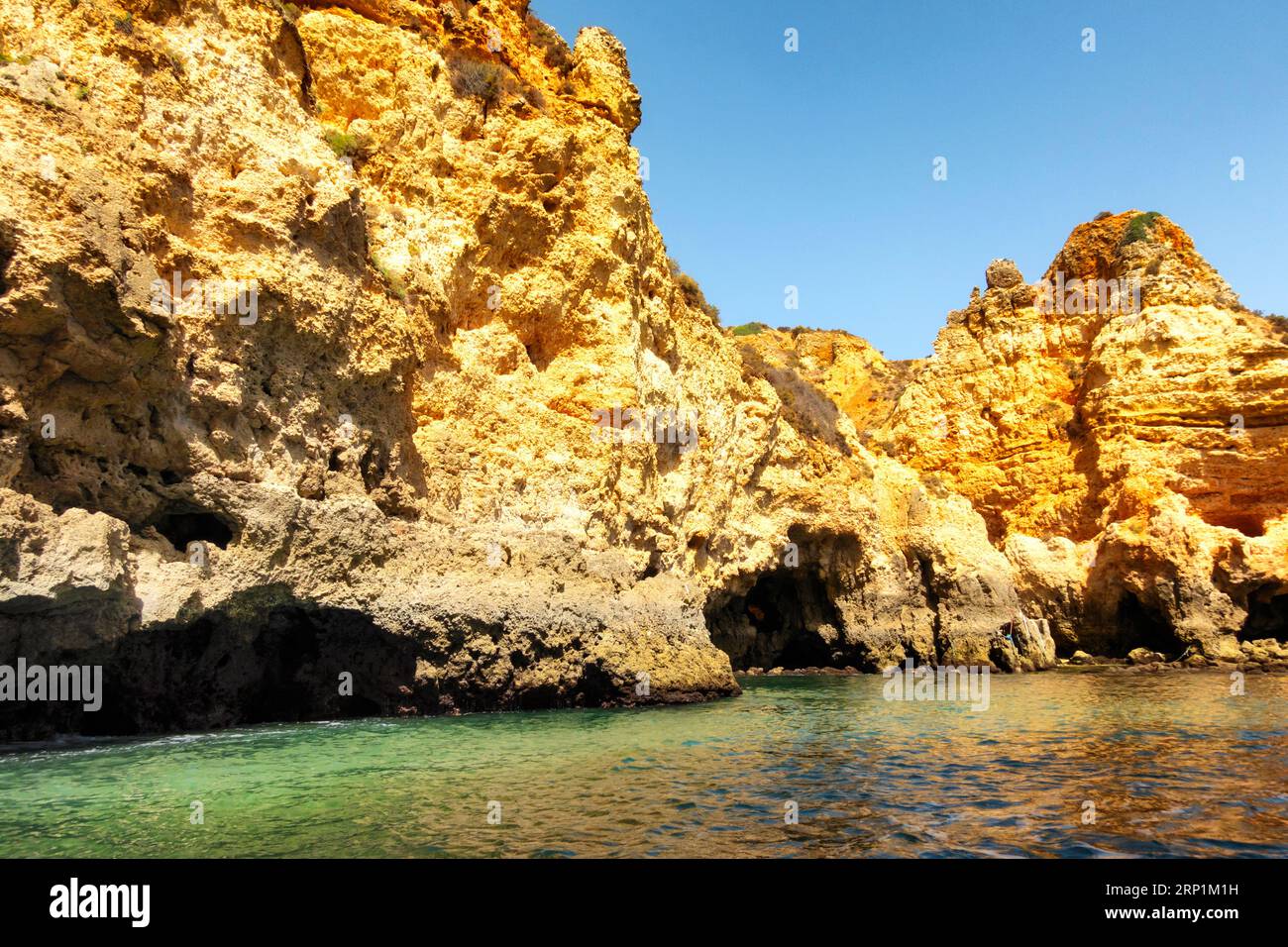 Caves and crags of Lagos in Algarve, Portugal Stock Photo - Alamy