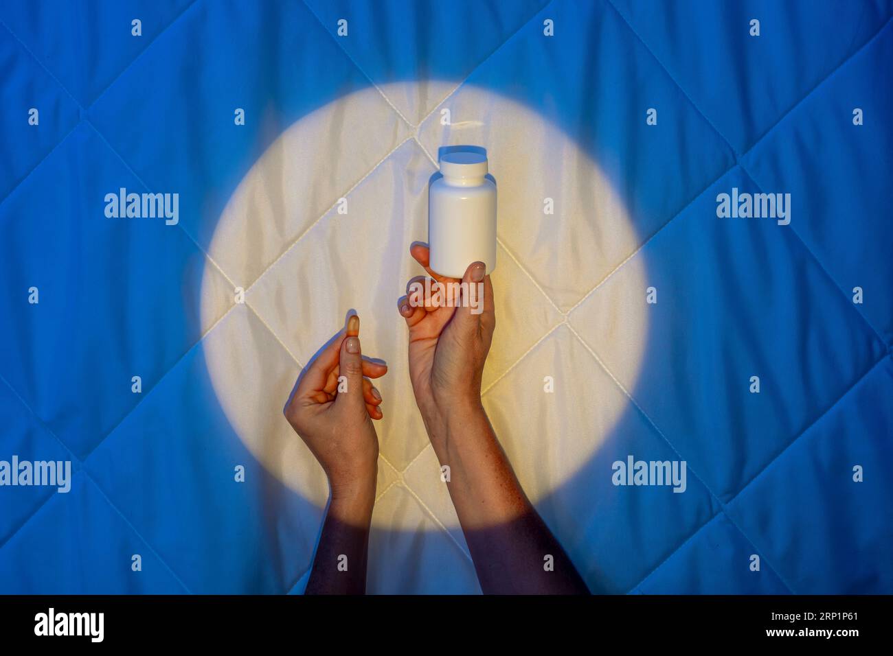 Sleeping capsule, hand in moonlight on a blanket, Melatonin's Fight ...