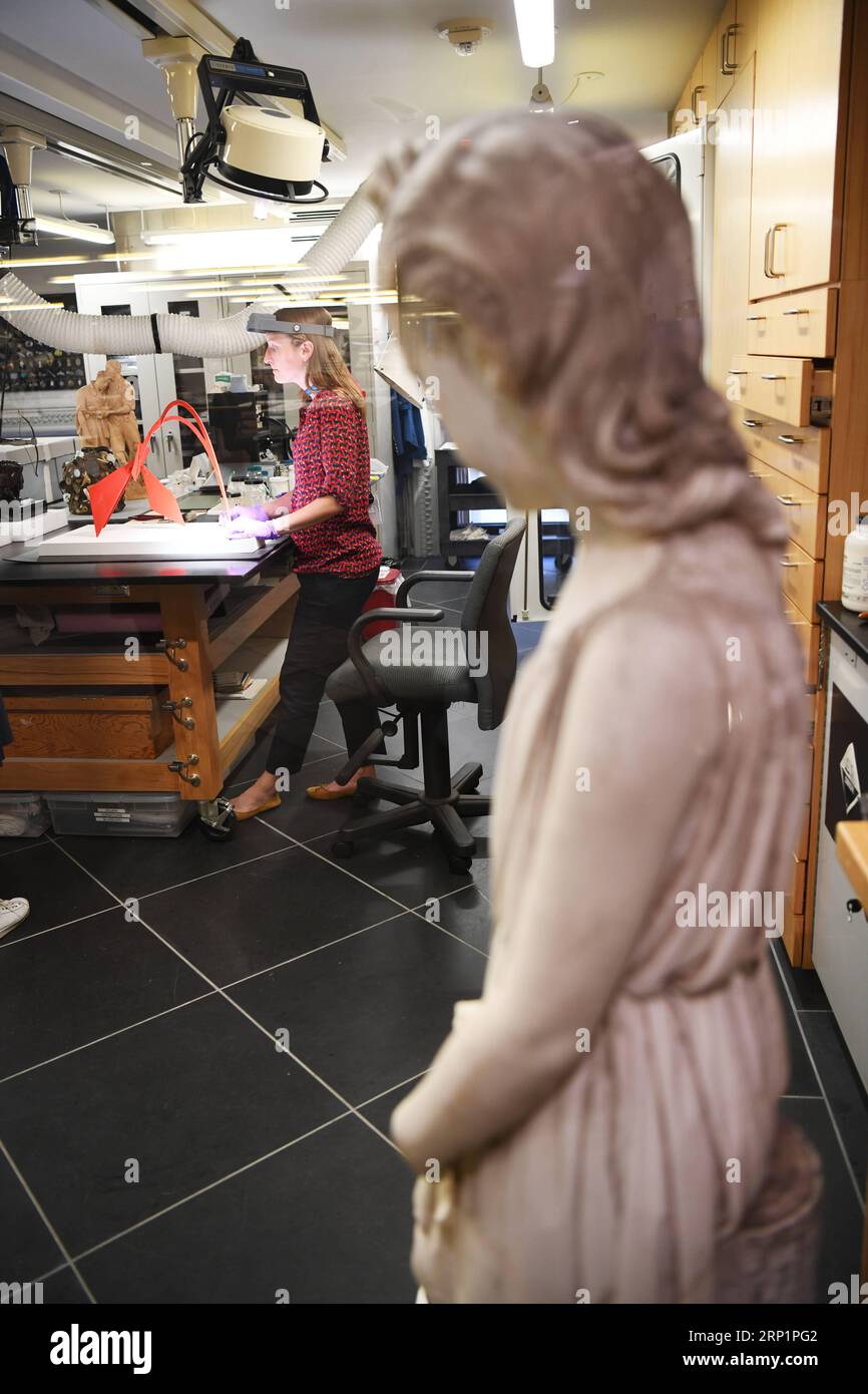 (180718) -- WASHINGTON, July 18, 2018 -- A conservator makes a ...