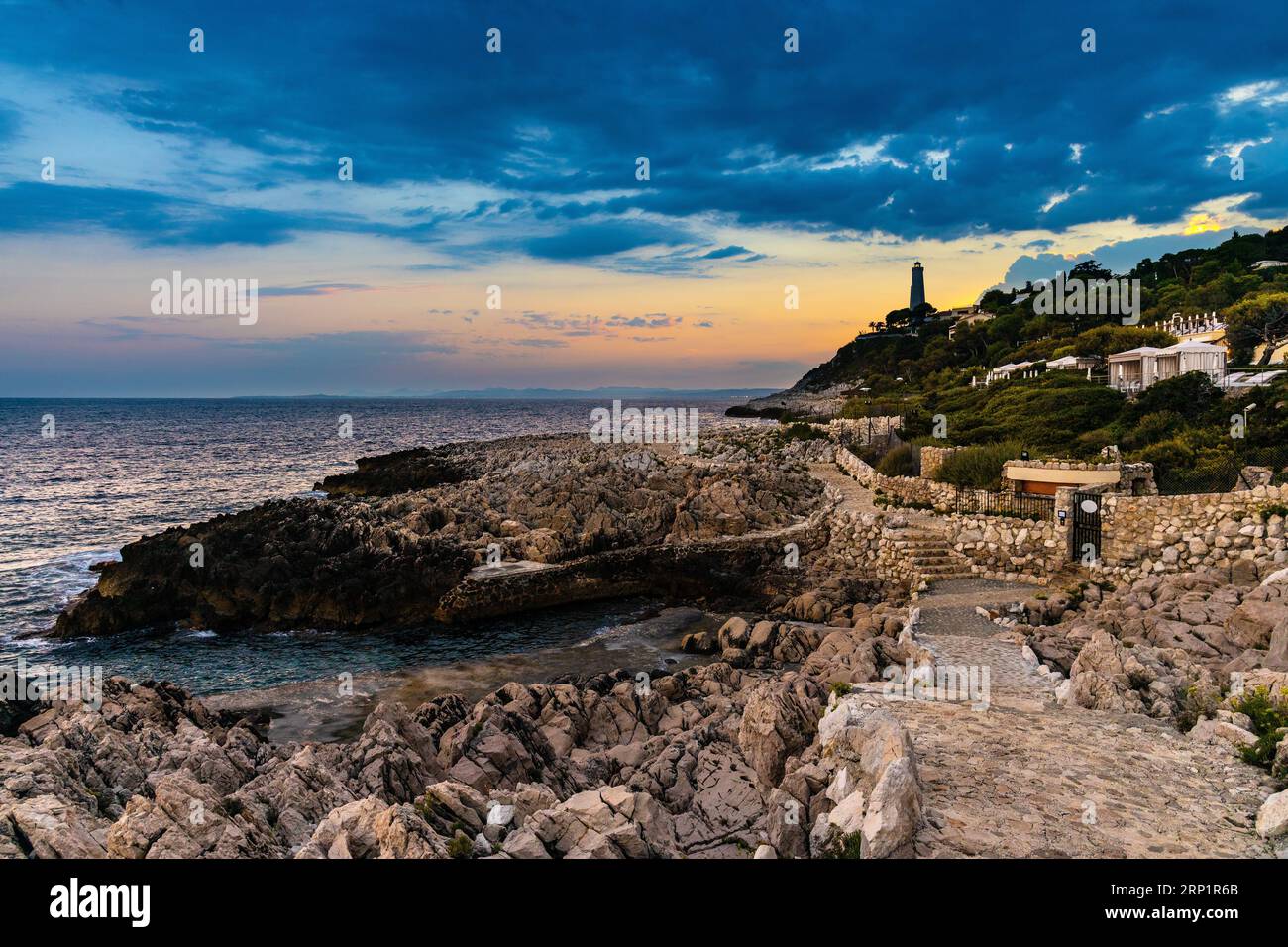 Saint Jean Cap Ferrat, France - August 5, 2022: Sunset over rocky coast ...