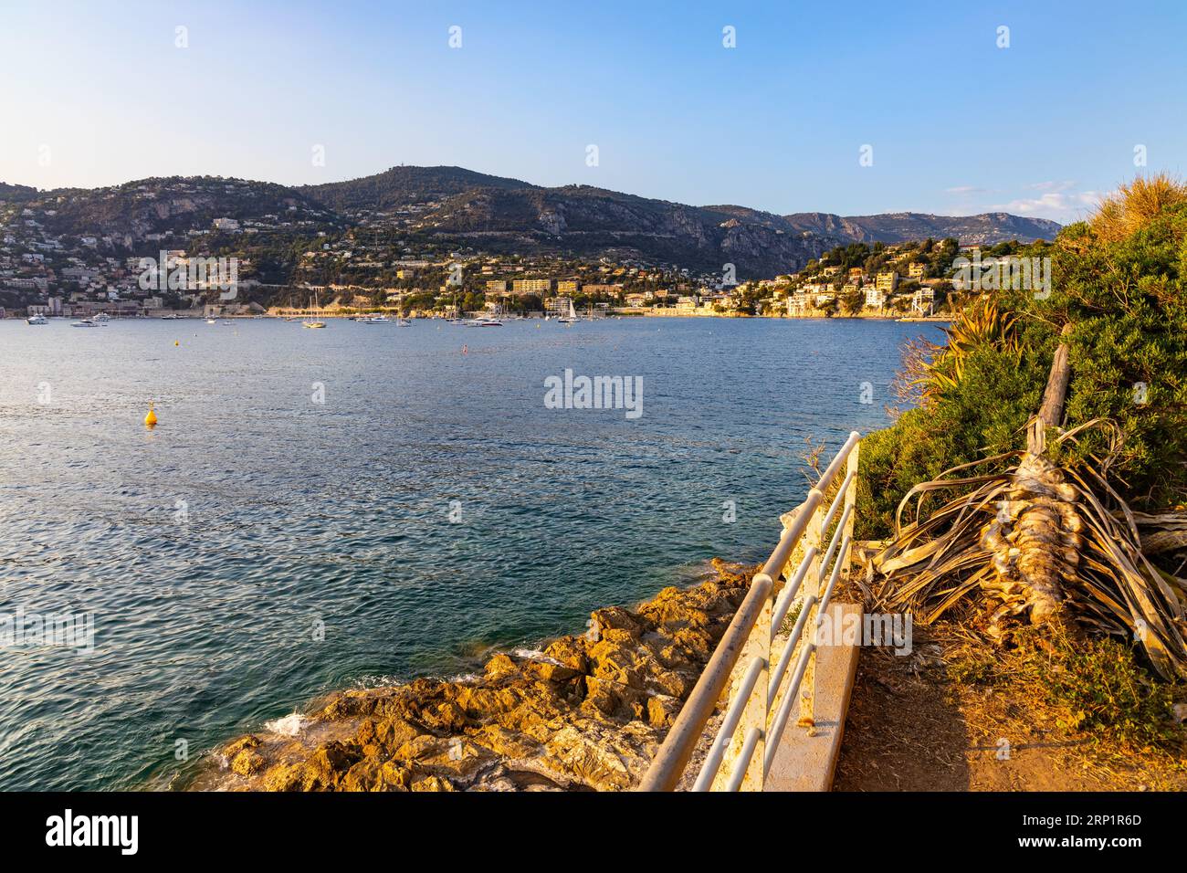 Rocky shoreline landscape of Saint-Jean-Cap-Ferrat resort town with ...
