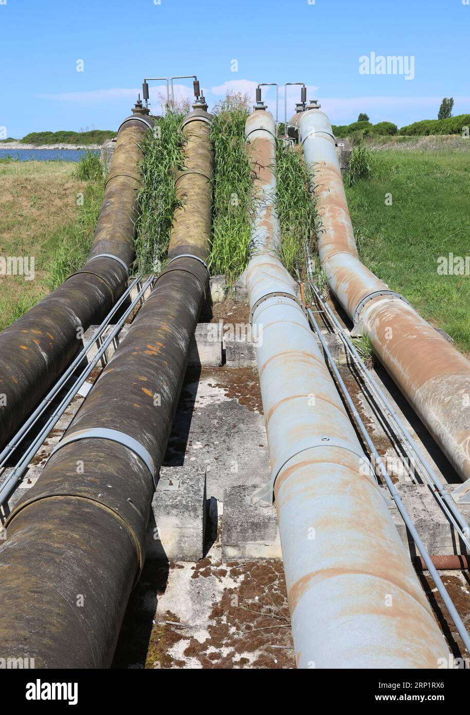 large steel pipes of the powerful dewatering pumps for the reclamation ...