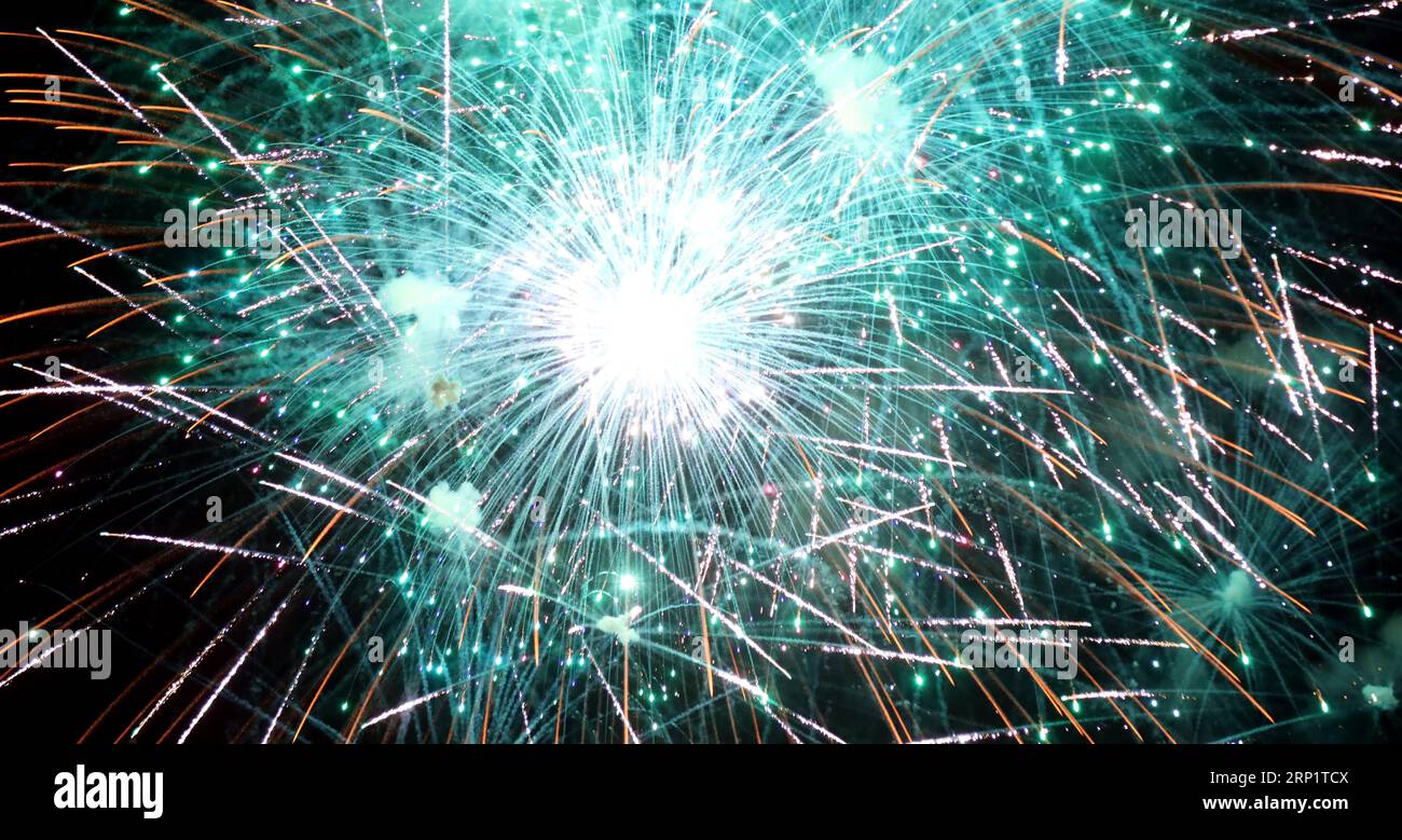colorful fiery sparks from huge fireworks during night celebrations ...