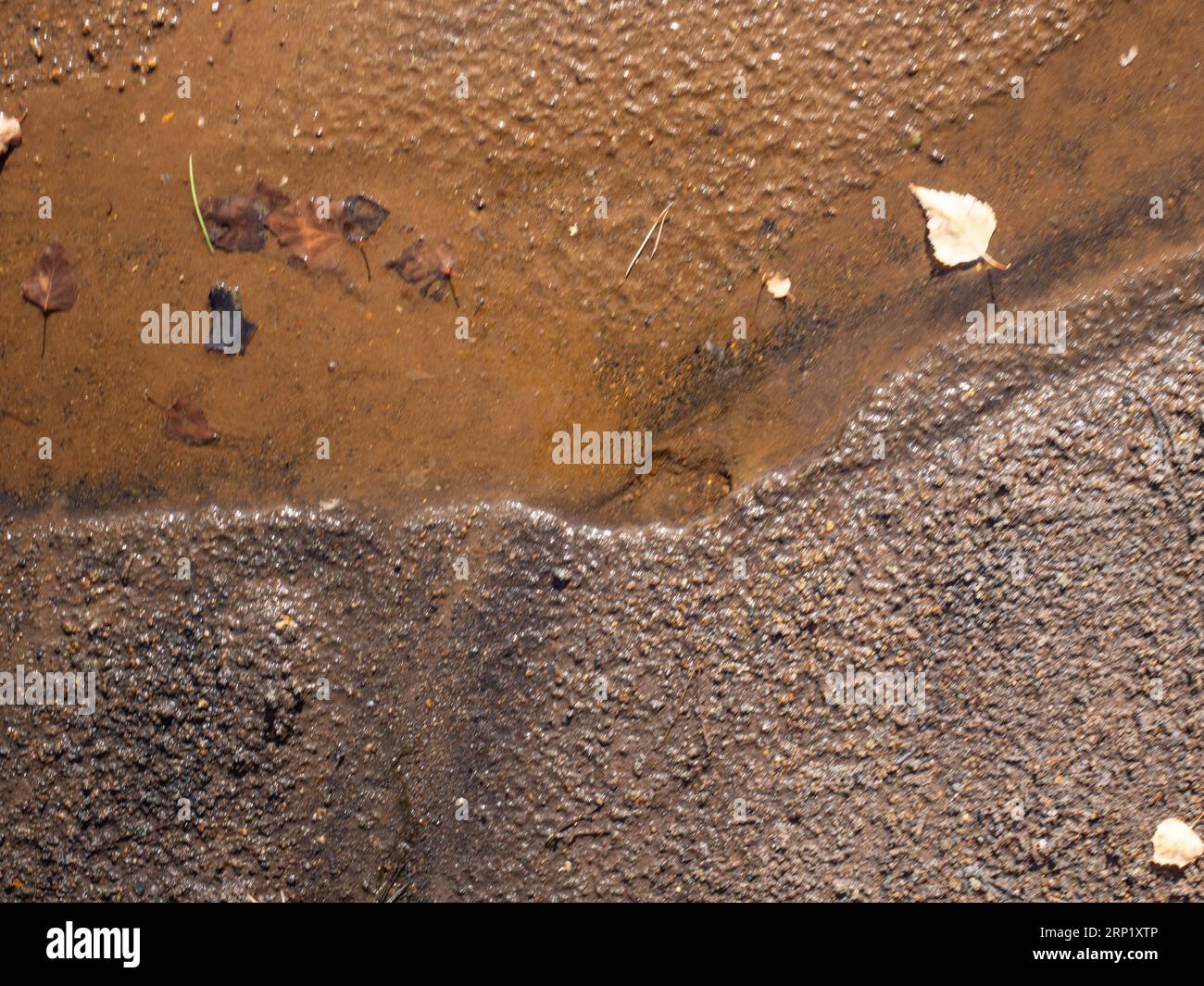 Rusty sand on the beach of colapsed coal mine. Geological park at ...