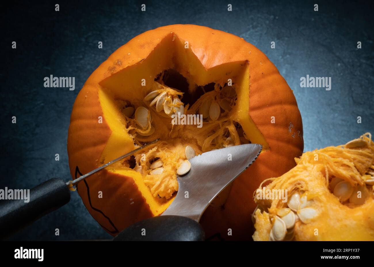 Halloween pumpkin gutting before carving Jack-o'-lantern. Guts, seeds ...