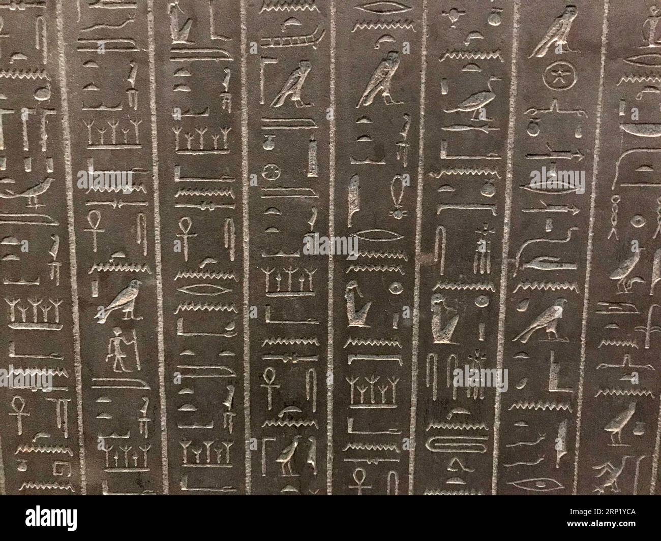 Egyptian hieroglyphs carved in stone background Stock Photo - Alamy