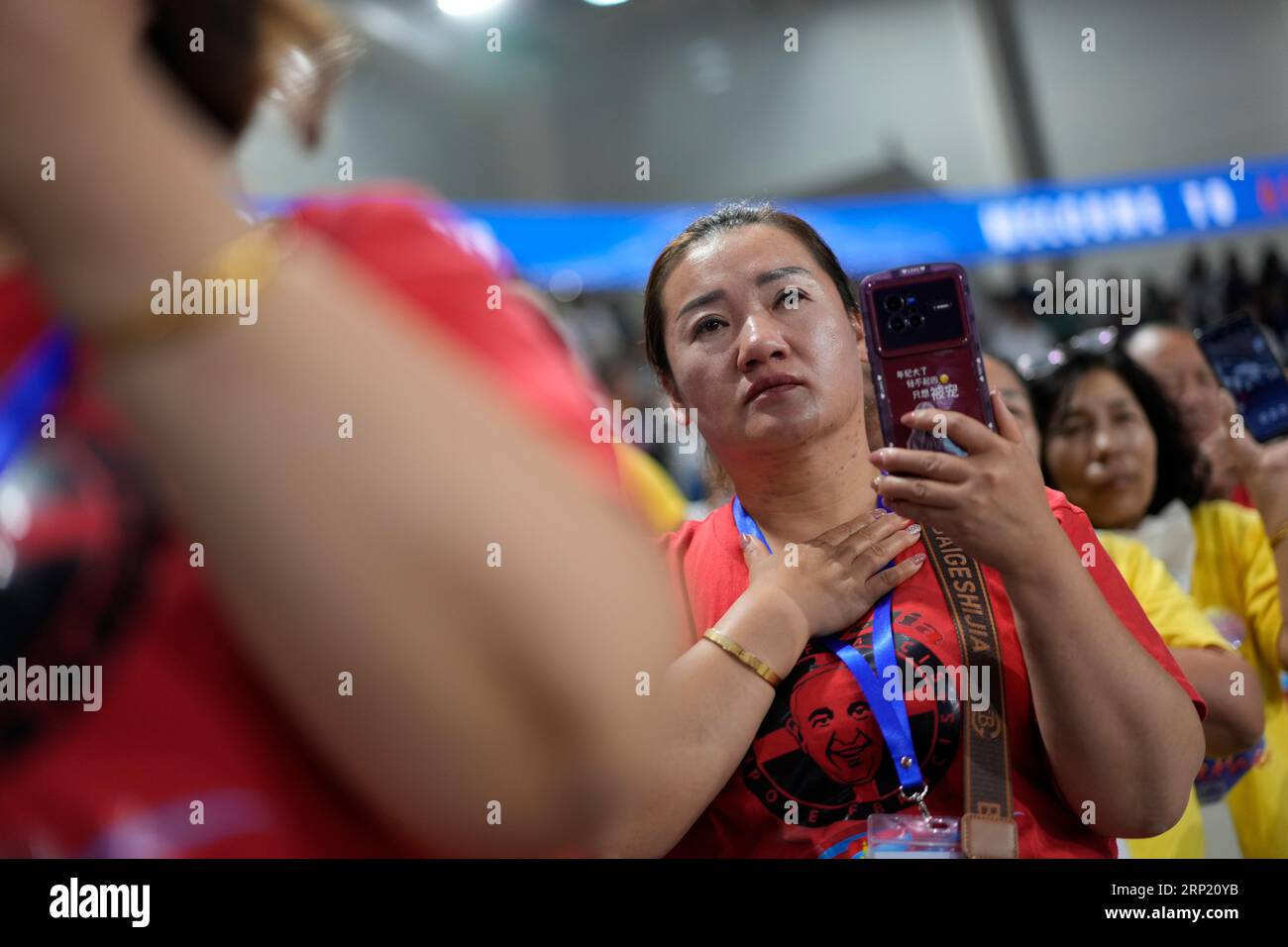 A faithful follows the Mass presided over by Pope Francis and celebrated by Apostolic Prefect ...