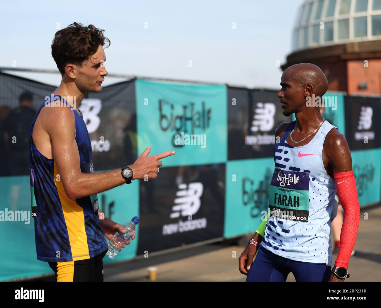 Sir Mo Farah (right) speaks to winner Jack Rowe after finishing fourth ...