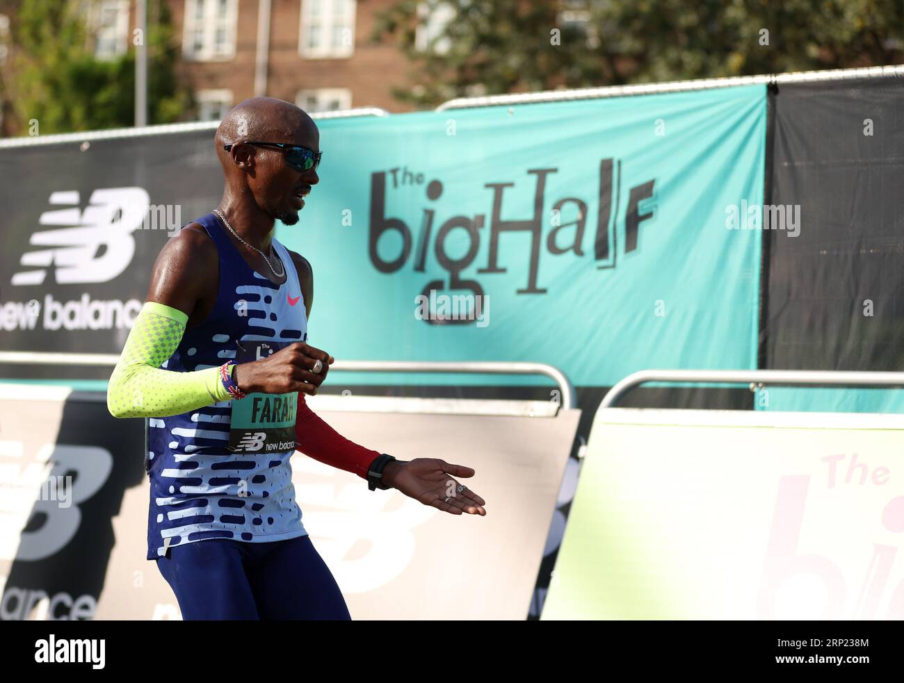 Sir Mo Farah crosses the finish line to place fourth in the Men's Elite ...
