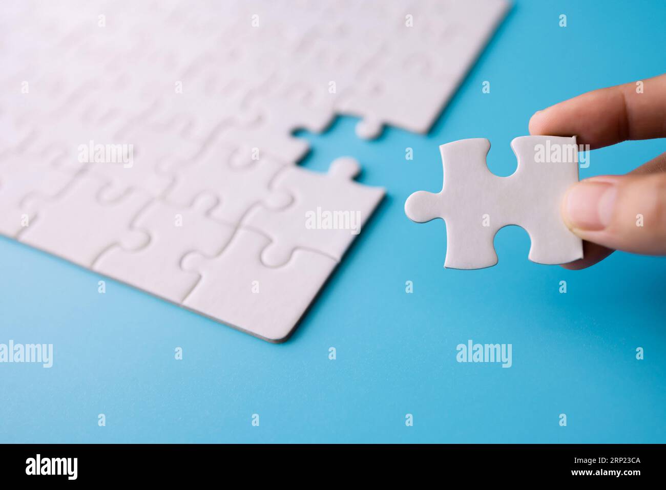 jigsaw connection White puzzle in the hands of a businessman Business ...