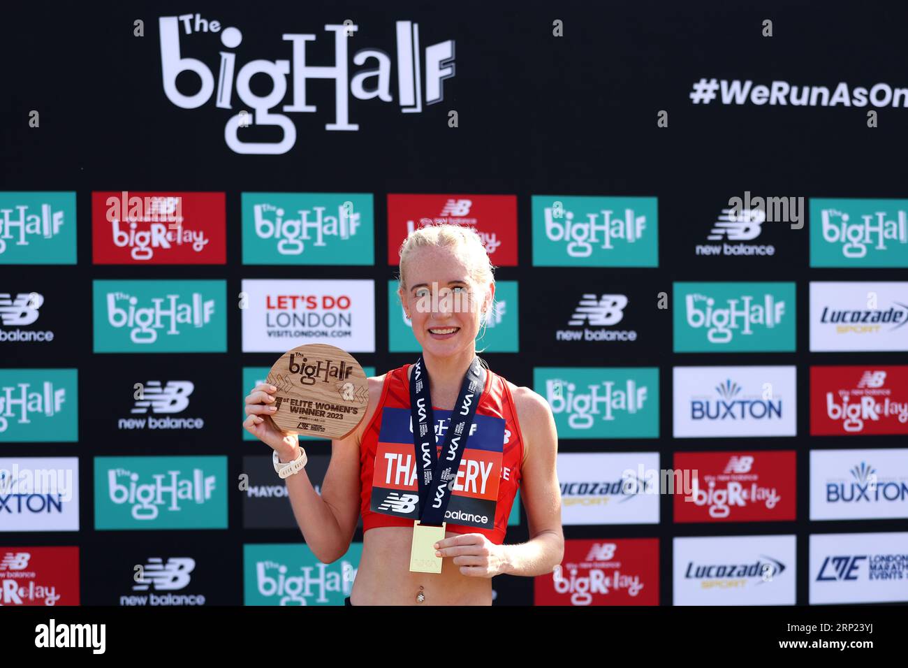 Calli Thackery with her trophy and medal for the Women's Elite race ...