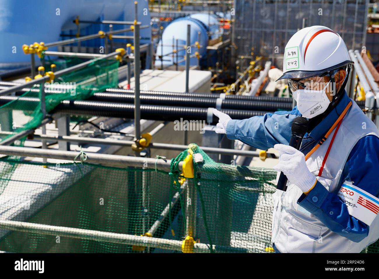 Futaba, Japan. 3rd Sep, 2023. TEPCO official Matsuo Keisuke guides ...
