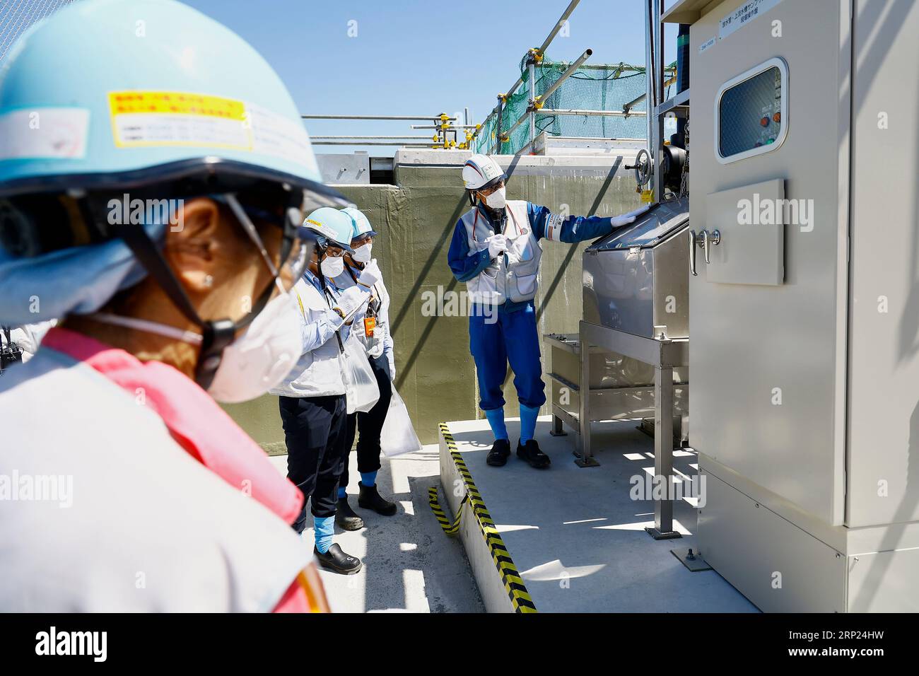 Futaba, Japan. 3rd Sep, 2023. TEPCO official Matsuo Keisuke guides ...