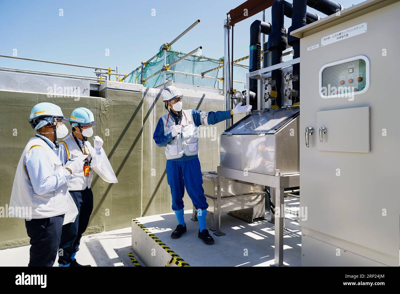Futaba, Japan. 3rd Sep, 2023. TEPCO official Matsuo Keisuke guides ...