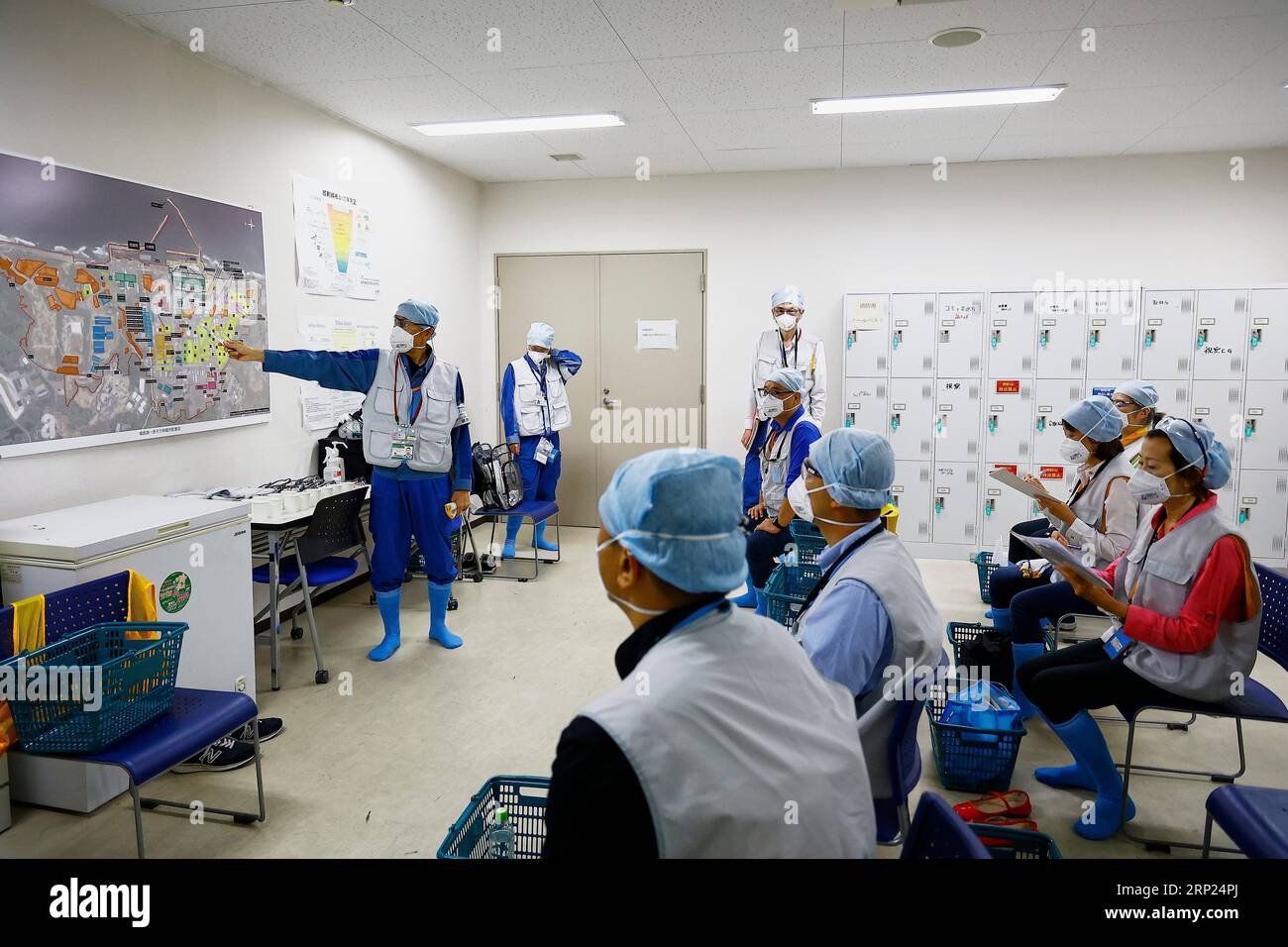 Futaba, Japan. 3rd Sep, 2023. TEPCO official Matsuo Keisuke explains to ...