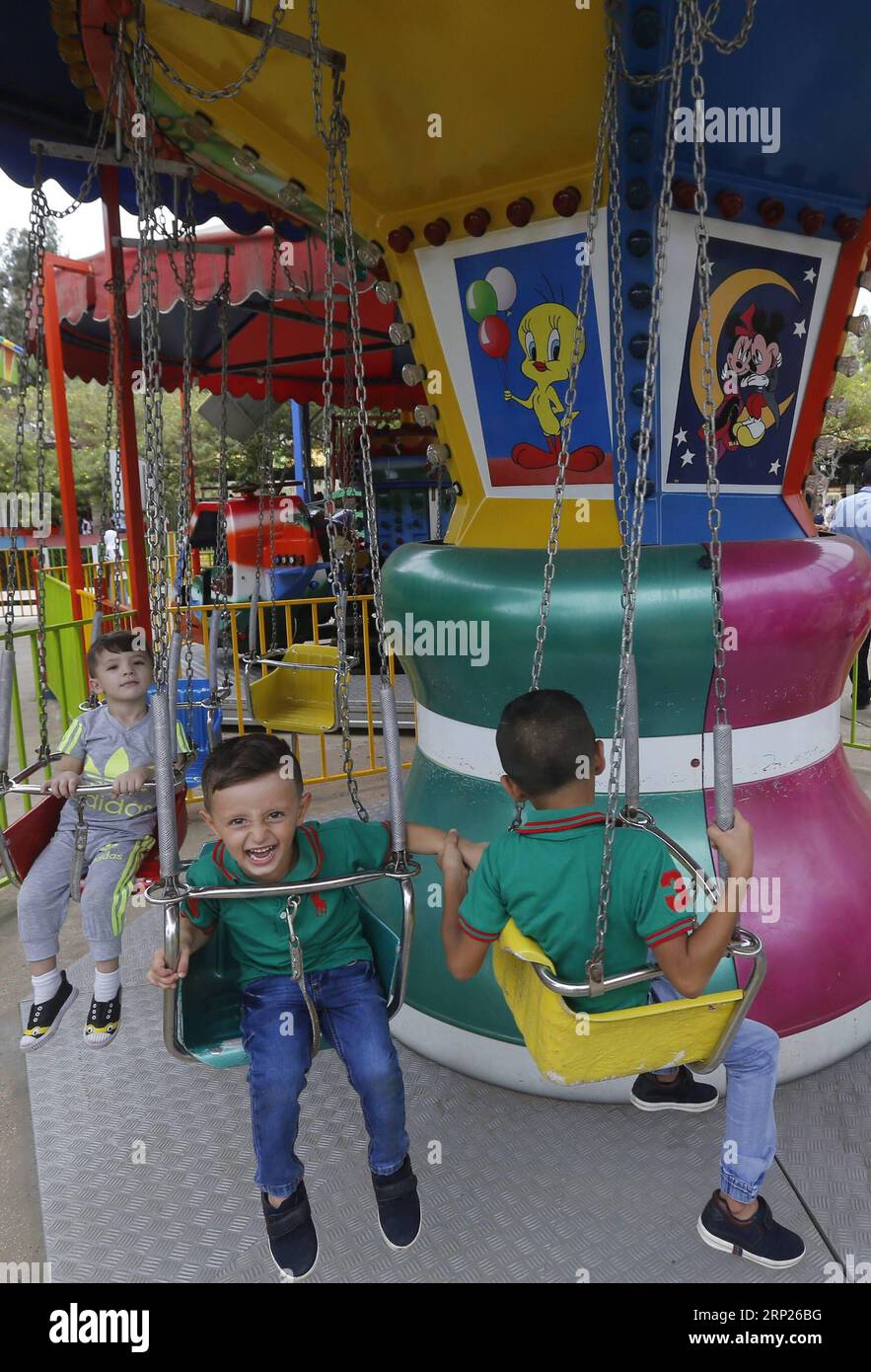 (180821) -- BEIRUT, Aug. 21, 2018 -- Children play at a playground to ...