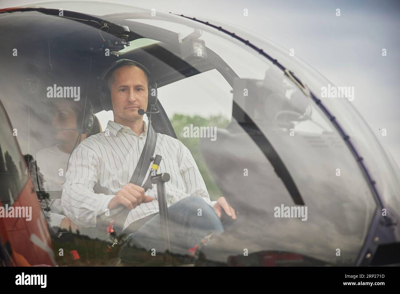 Taastrup, Denmark,11th August 2023: Man in the cockpit of a helicopter ...