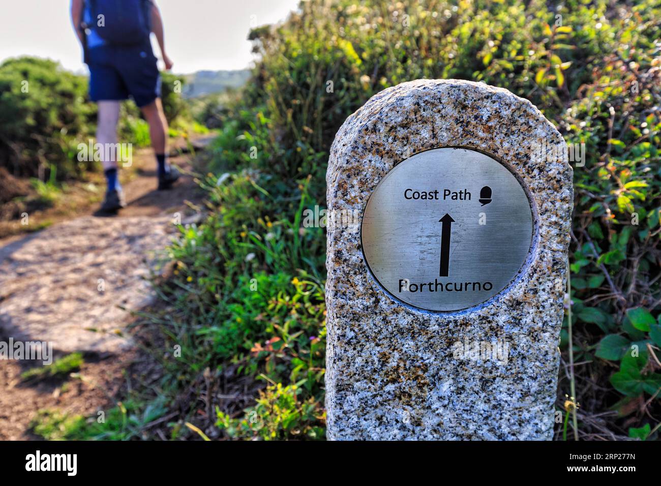 Walkers next to waymarker, South West Coast Path, signpost to ...