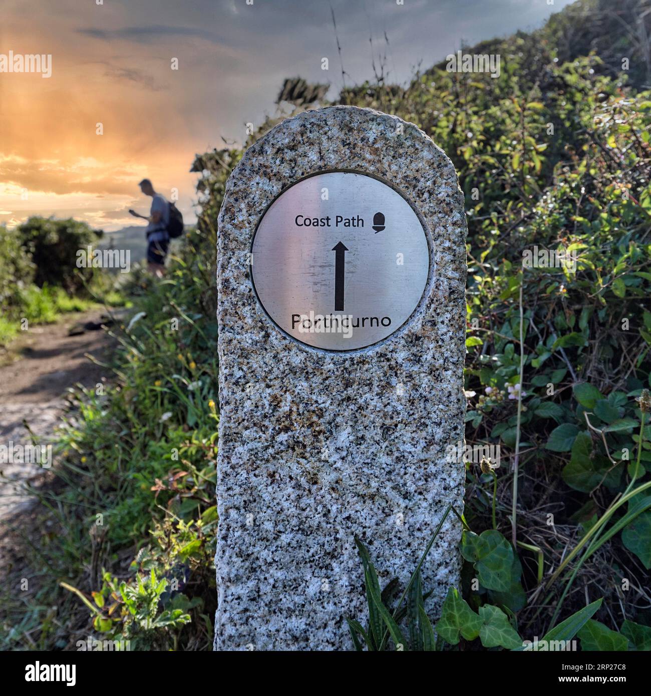 Walkers next to waymarker, South West Coast Path, signpost to ...