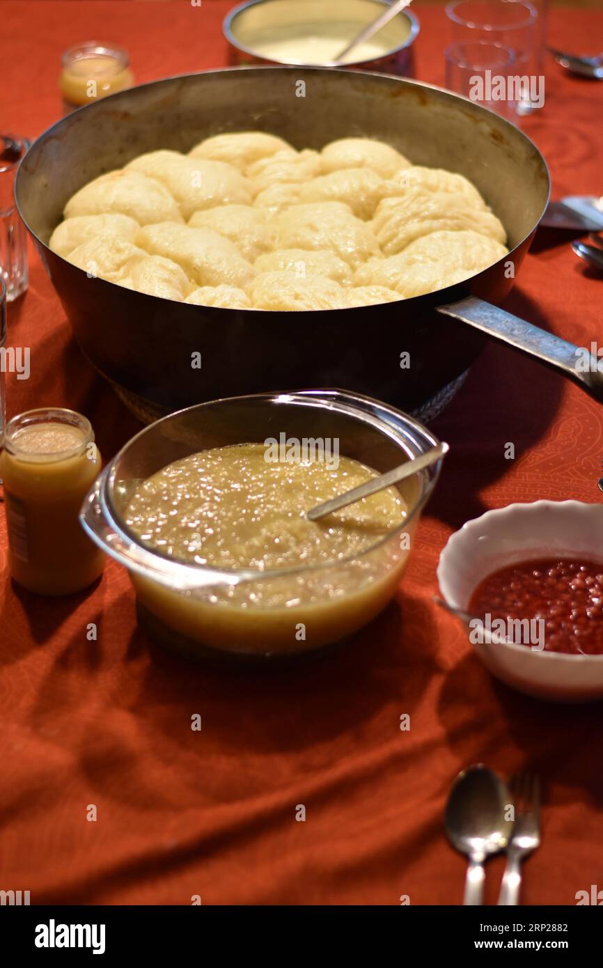Steam noodles in rustic old steam noodle pan, with apple sauce and ...
