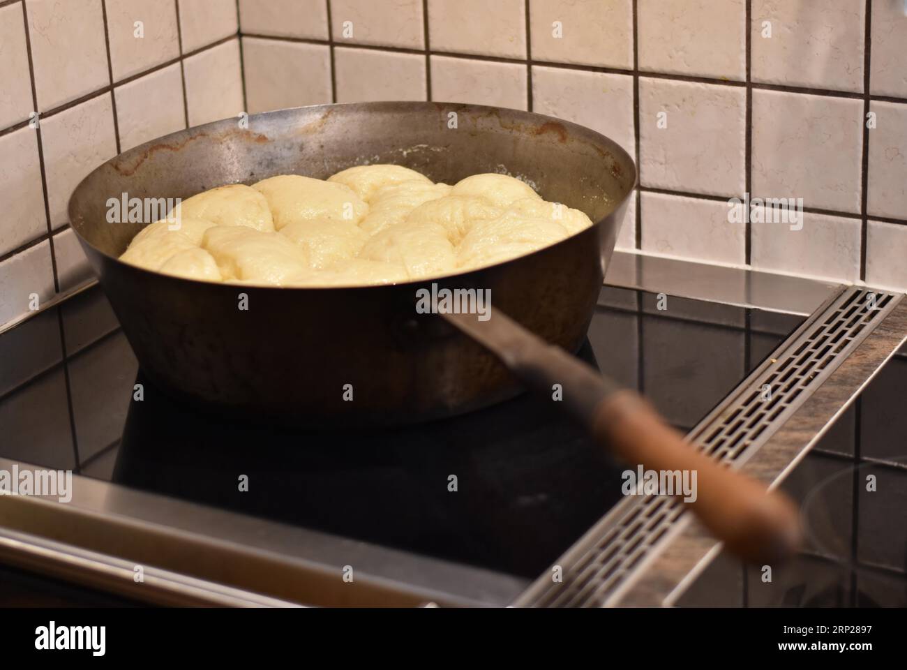 Preparation of steam noodles in rustic old steam noodle pan, typical ...