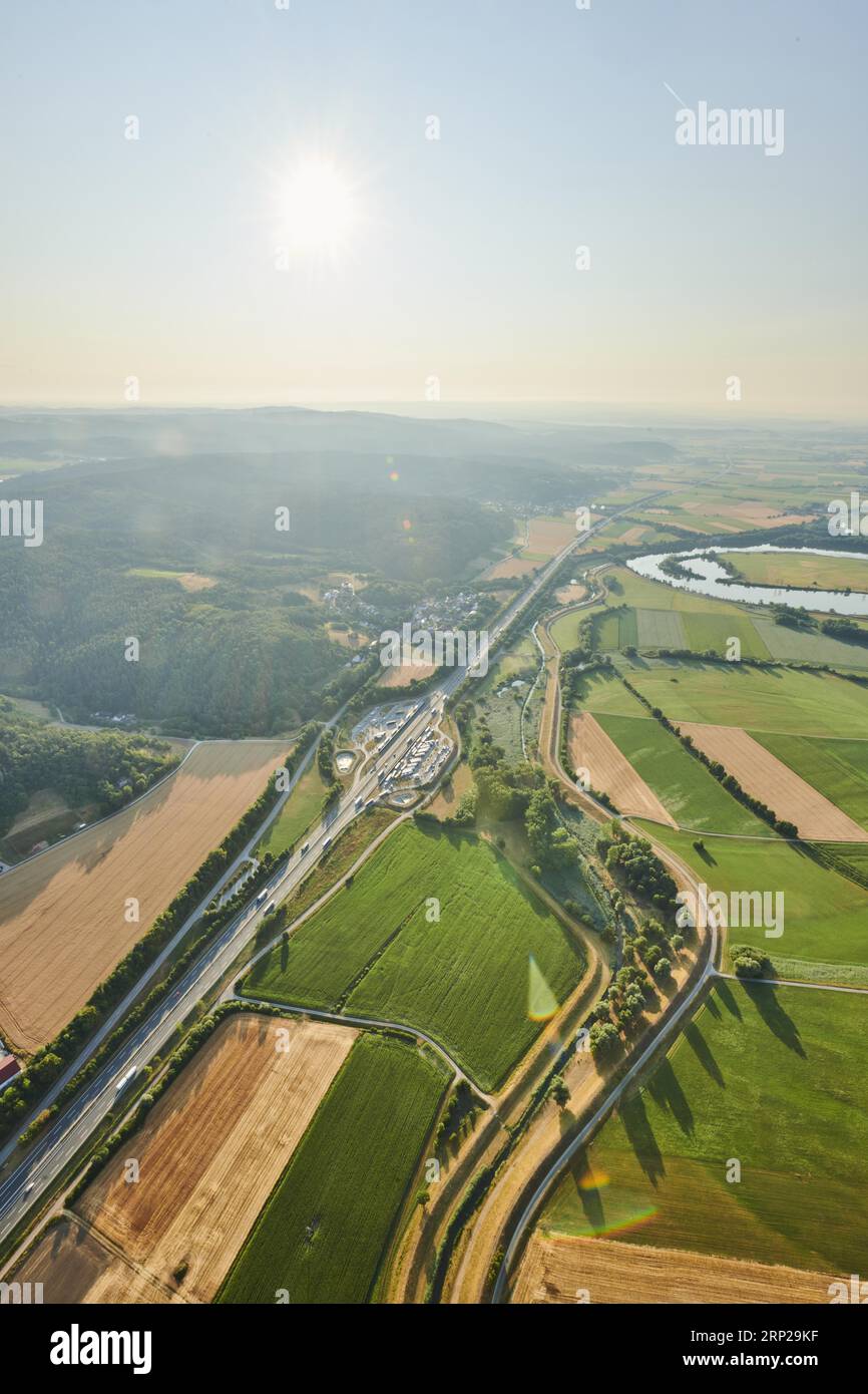 Aerial view over danubia river, the autobahn A3, the fields and forests ...