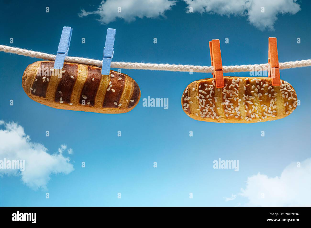 Delicious sweets hanging from the rope Stock Photo - Alamy