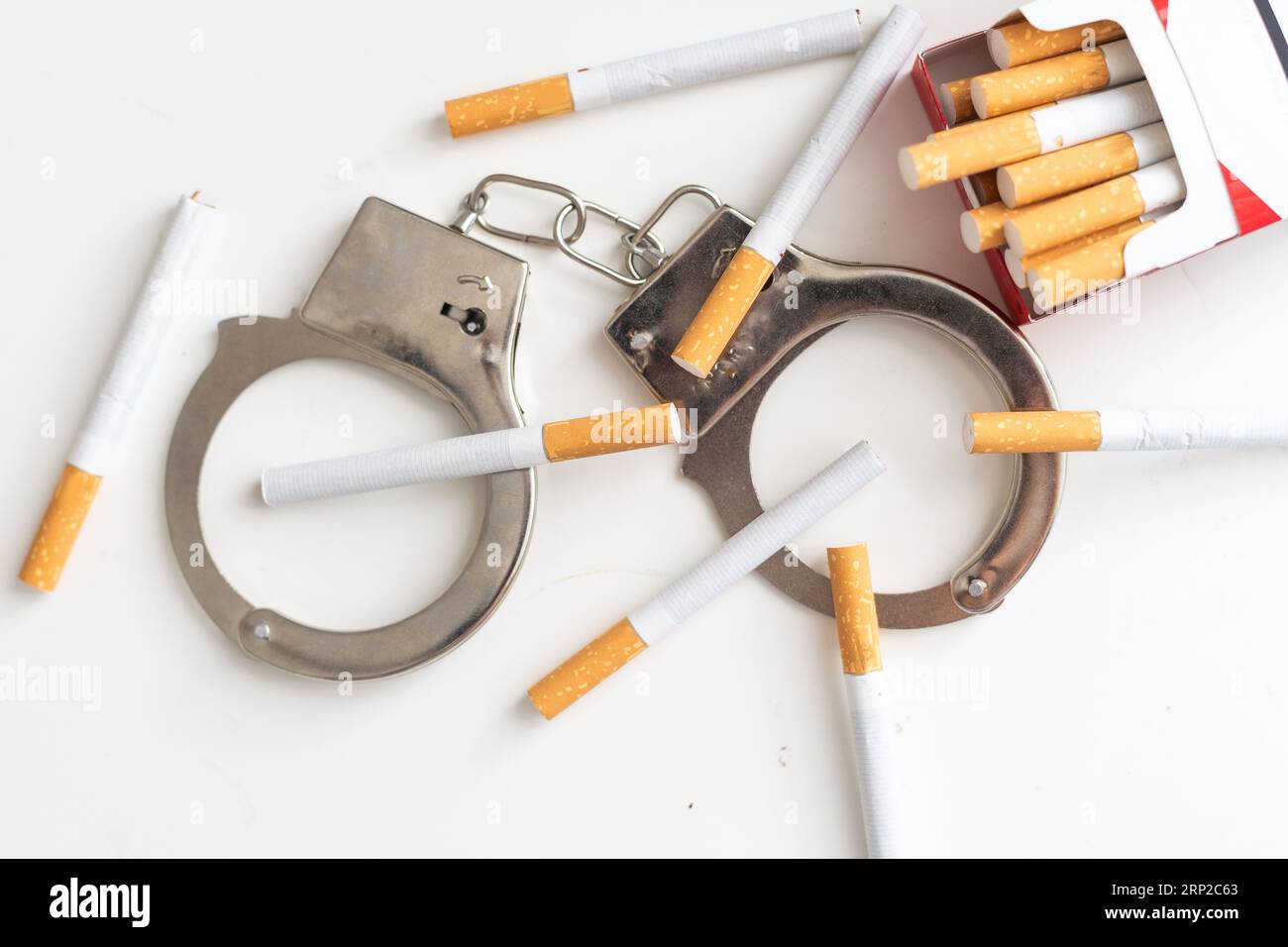 Addiction concept cigarettes handcuffs hi-res stock photography and ...