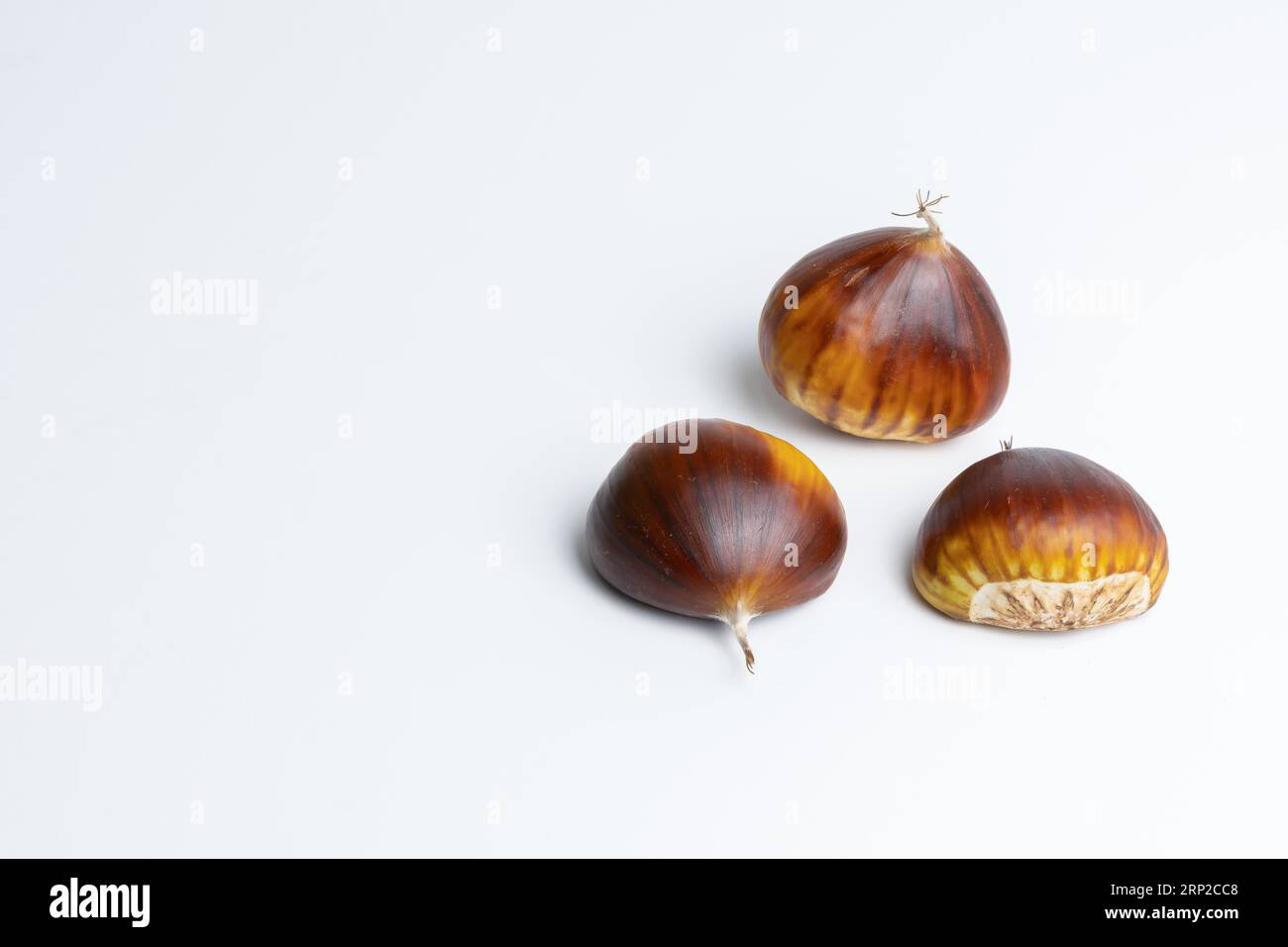 Seasonal chestnuts harvested from the field on a white background Stock ...