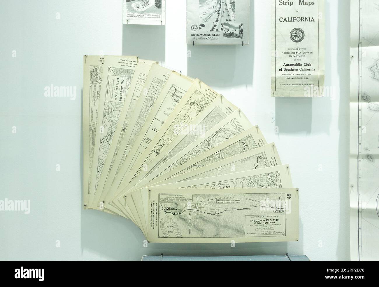 Vintage road maps of California displayed in a fan shape, showcasing ...