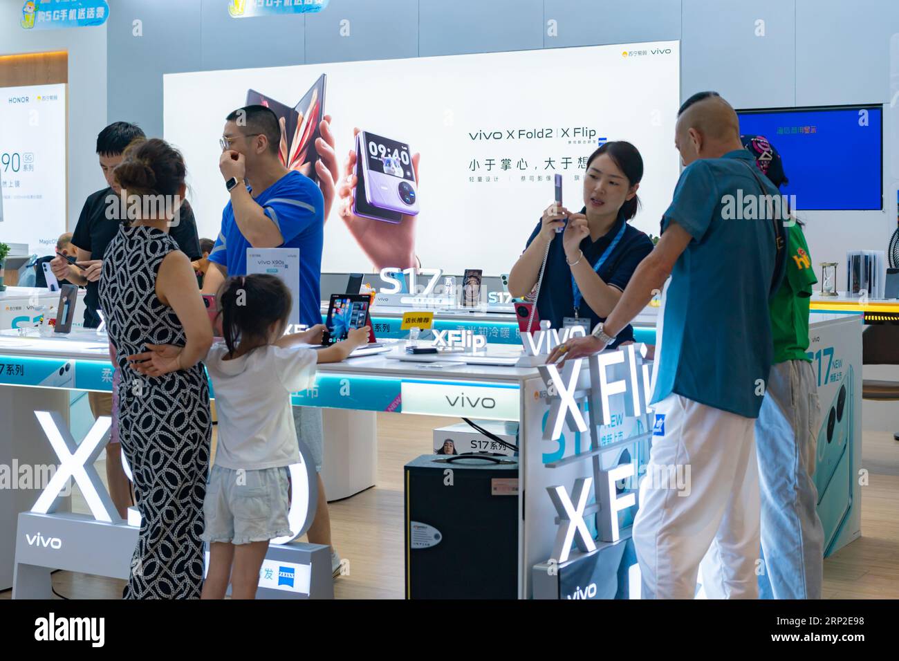 CHONGQING, CHINA - SEPTEMBER 3, 2023 - Citizens and children shop for ...