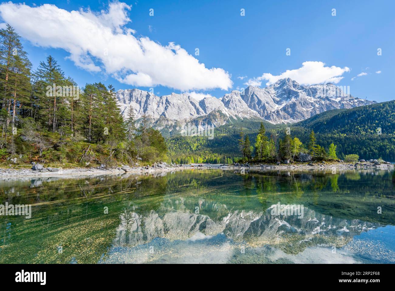 Zugspitze is reflected in lake eibsee hi-res stock photography and ...