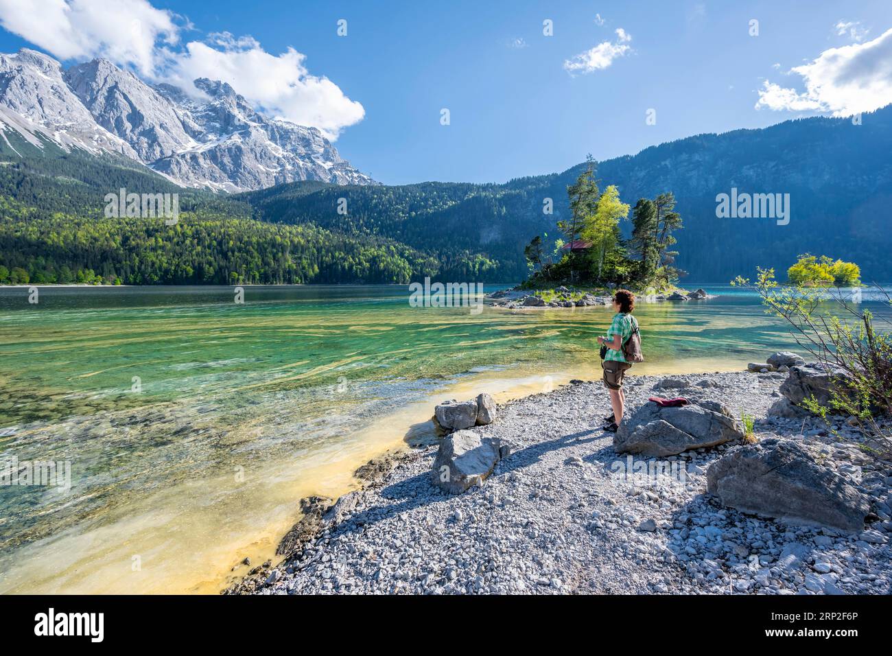 Tourist at the Eibsee lake, Zugspitze massif and Zugspitze, Wetterstein ...