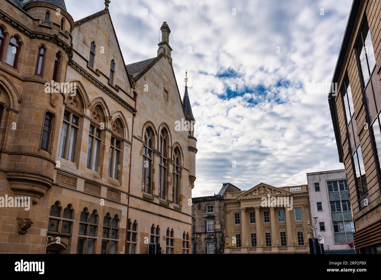 Tall tower and medieval buildings in the Scottish city of Inverness in ...