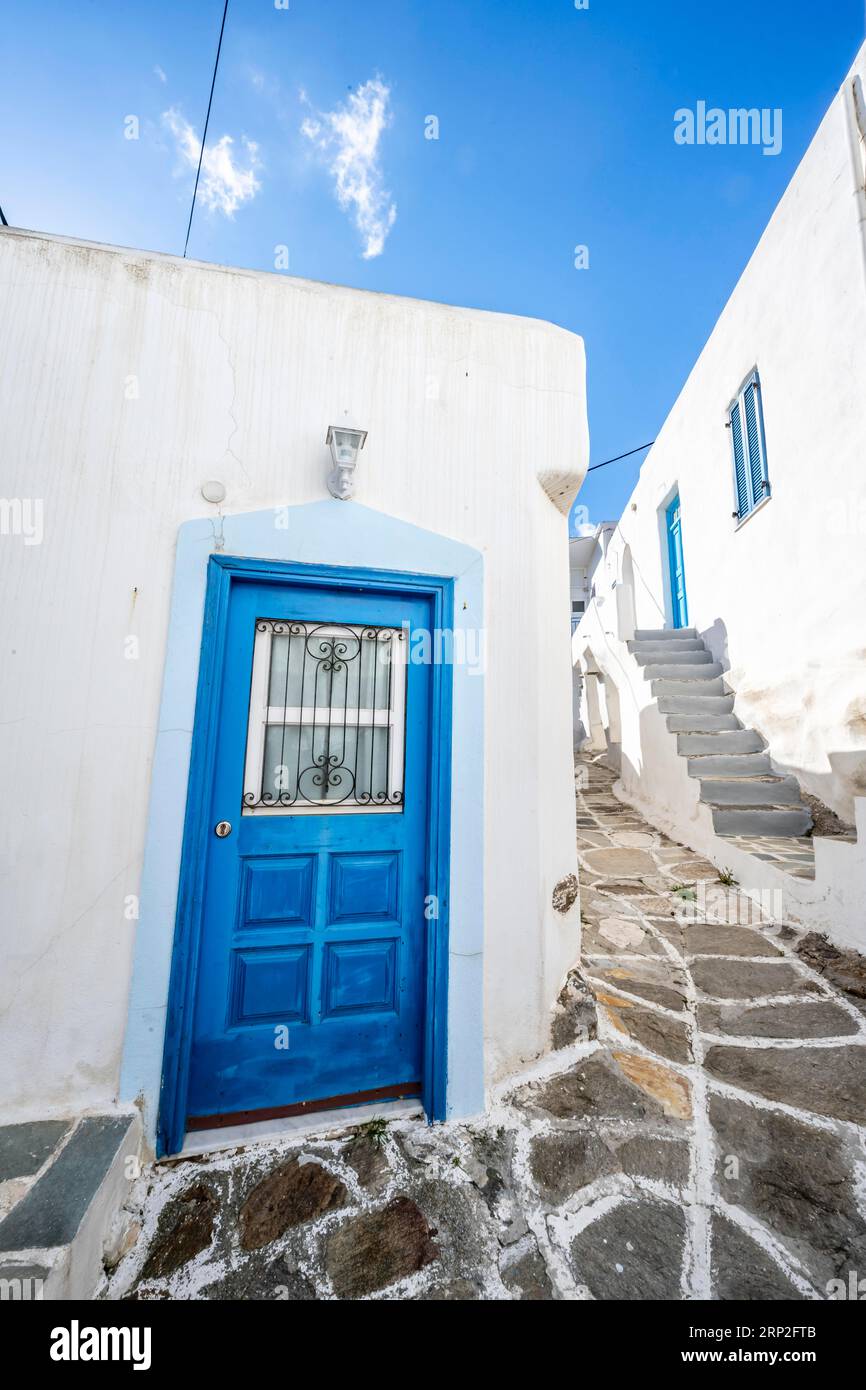 White Cycladic houses with blue windows and doors, picturesque alleys ...