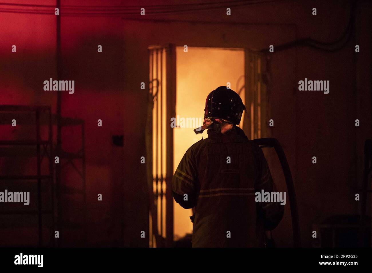 (180903) -- RIO DE JANEIRO, Sept. 3, 2018 -- A firefighter works at the ...