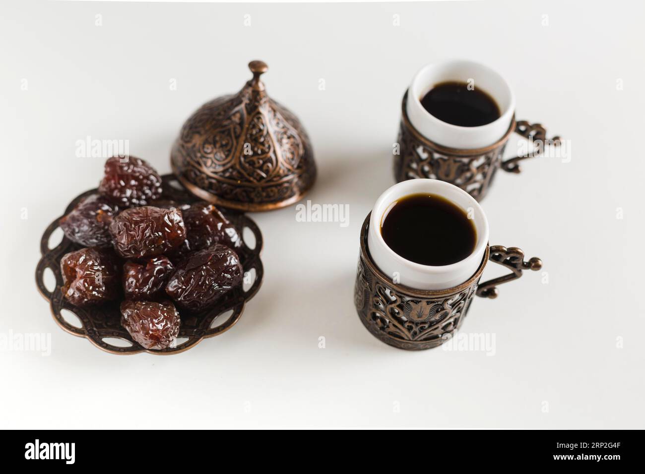 Coffee cups with dates saucer 1 Stock Photo - Alamy