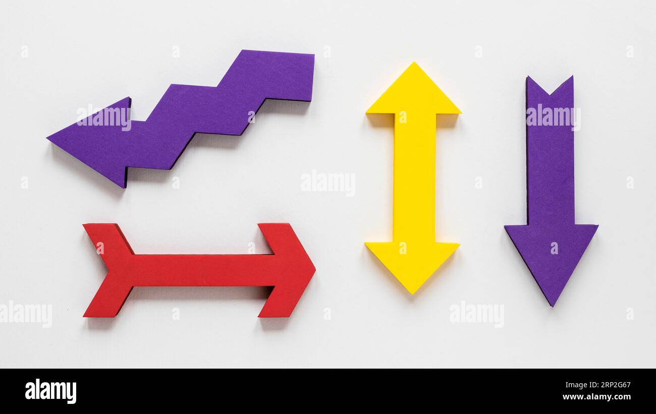 Flat lay colorful set arrows white background Stock Photo - Alamy