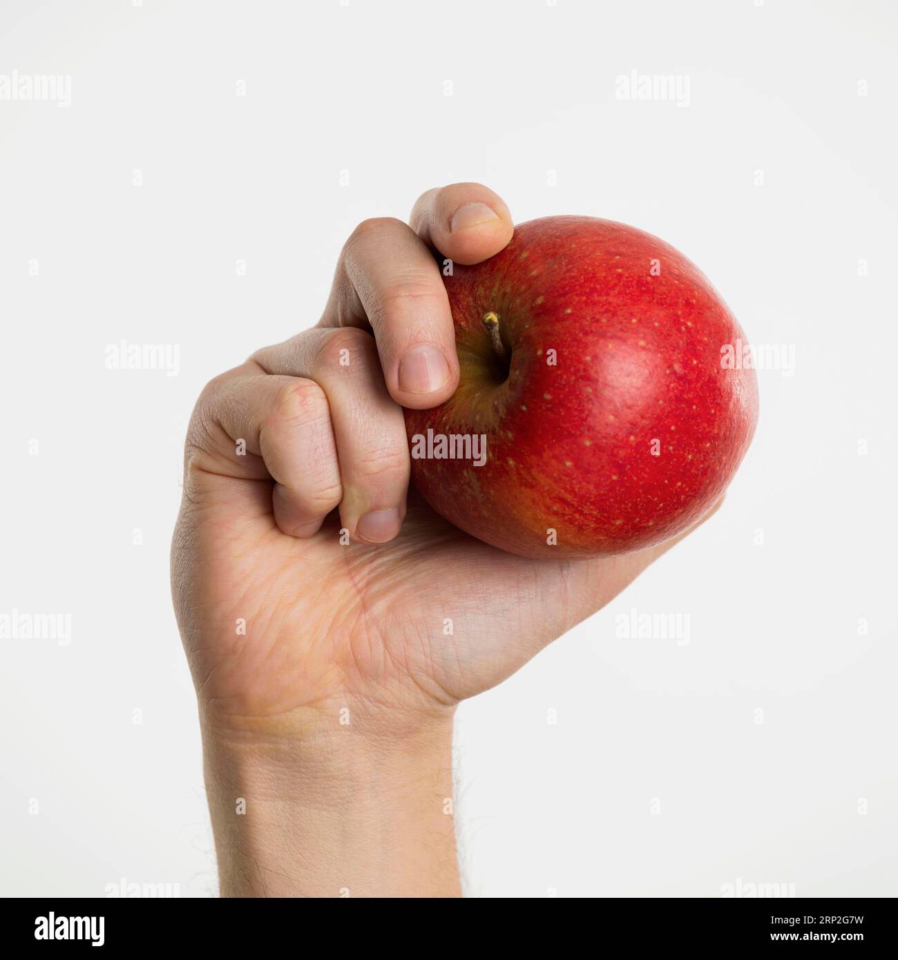 Hand holding apple Stock Photo - Alamy