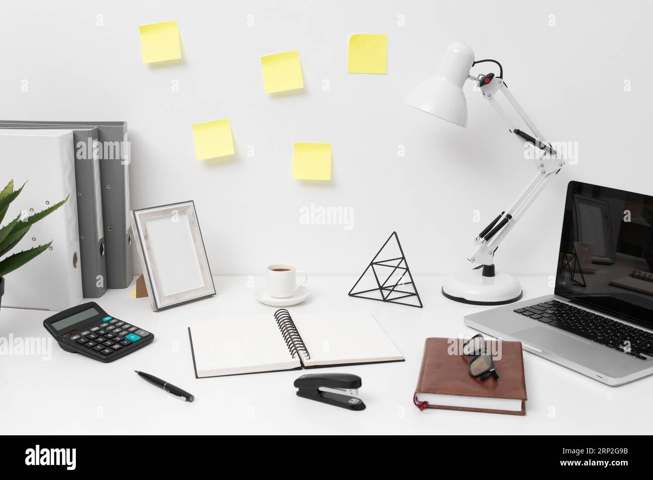 Front view office desk arrangement Stock Photo - Alamy