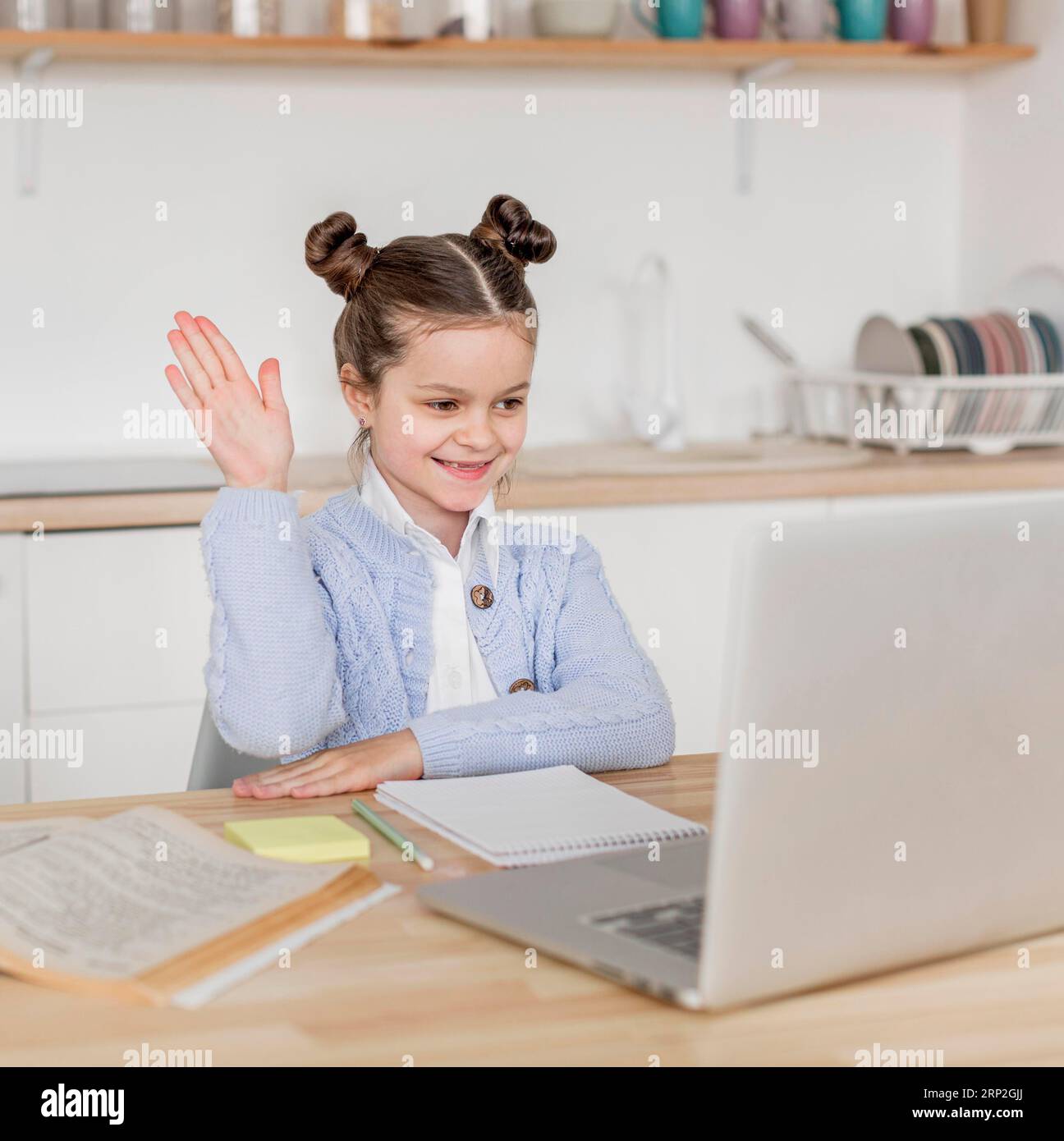 Little girl knowing answer her teacher s question Stock Photo - Alamy