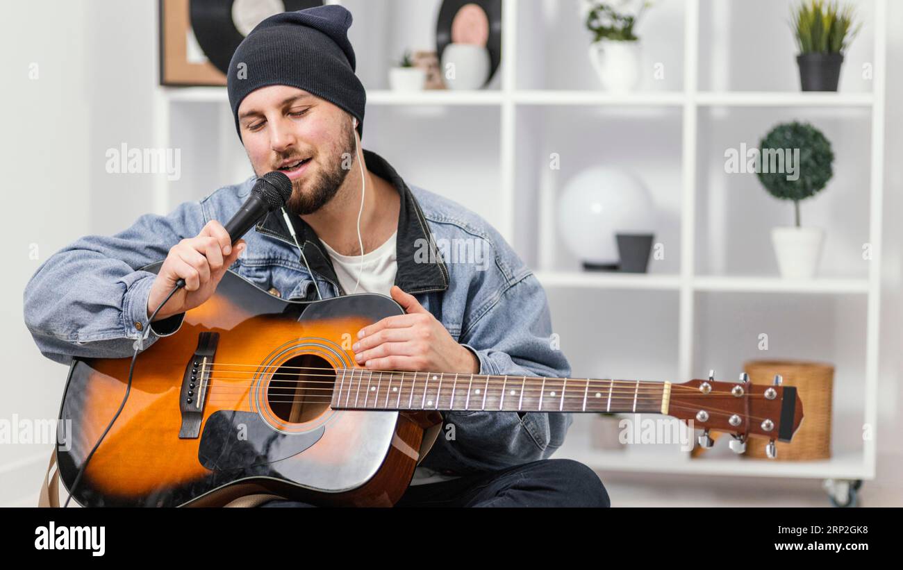 Medium shot musician singing Stock Photo - Alamy