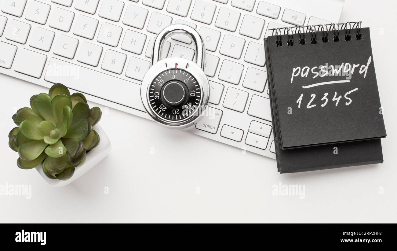 Top view lock keyboard with plant notebook Stock Photo - Alamy