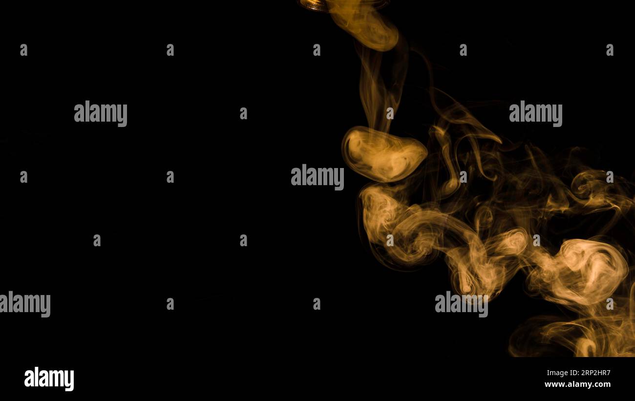 Yellow smoke curl black background with copy space writing text Stock ...