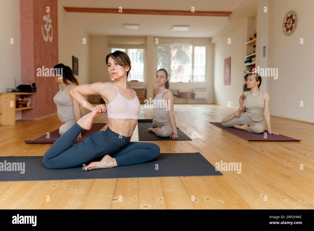 Yoga teacher teaching class 1 Stock Photo - Alamy