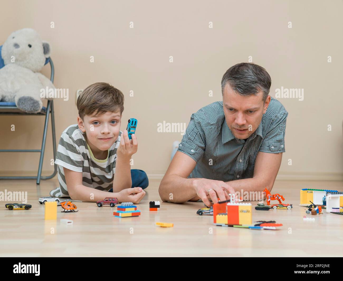 Father s day dad son playing with lego Stock Photo - Alamy