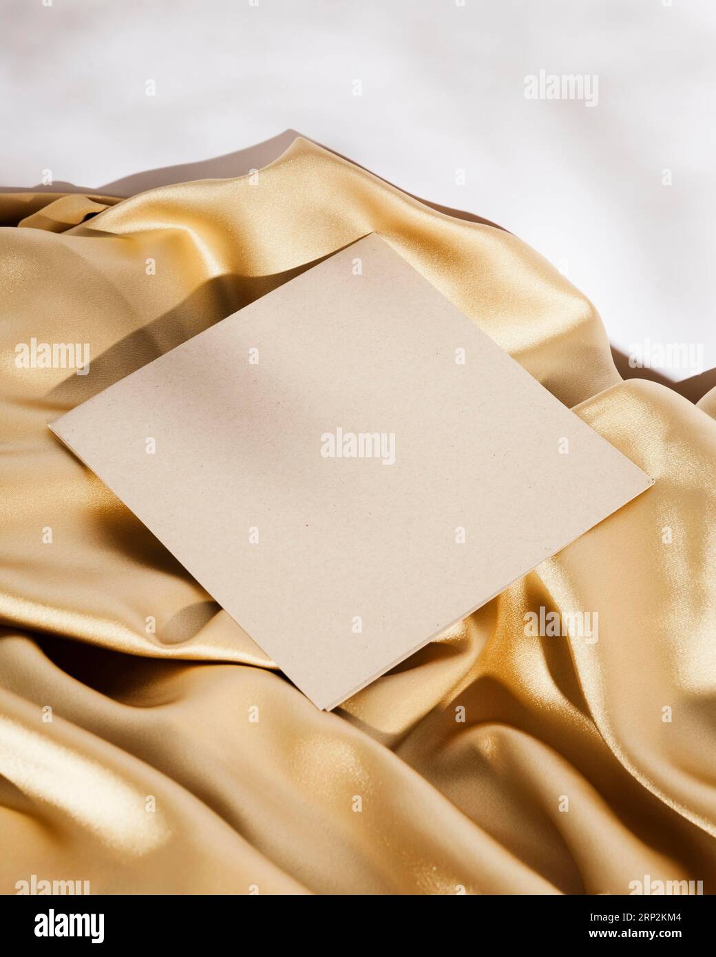 High angle white card golden cloth Stock Photo - Alamy